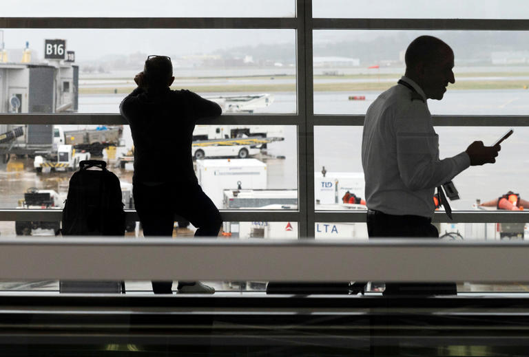 Flight cancellations and delays continue after US storms dump snow in ...