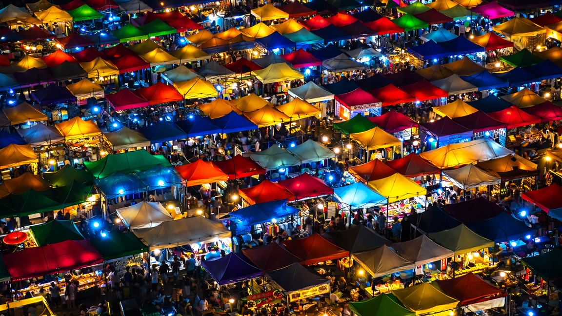 Night market shines with vibrant colors and tents