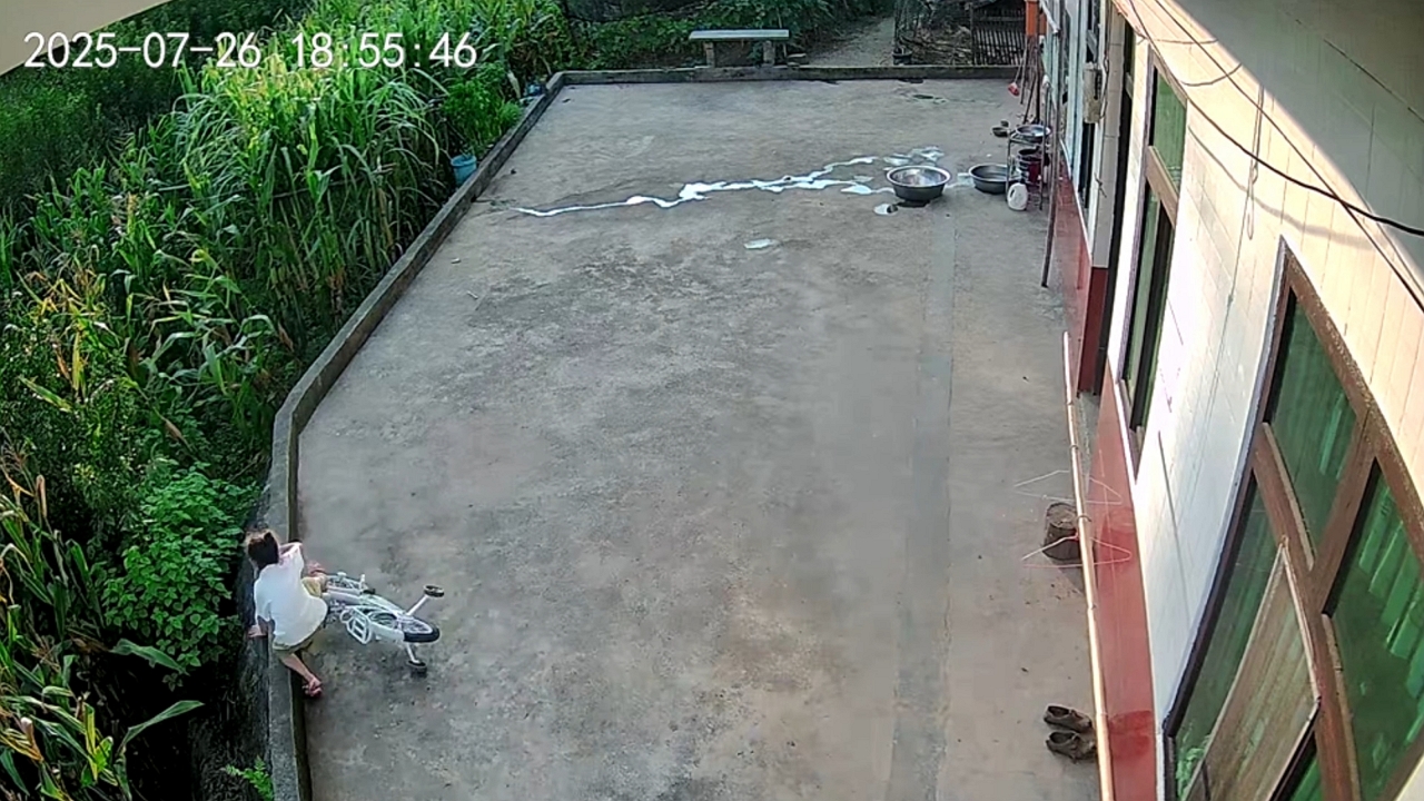 Girl loses balance while cycling and falls off concrete edge in ...
