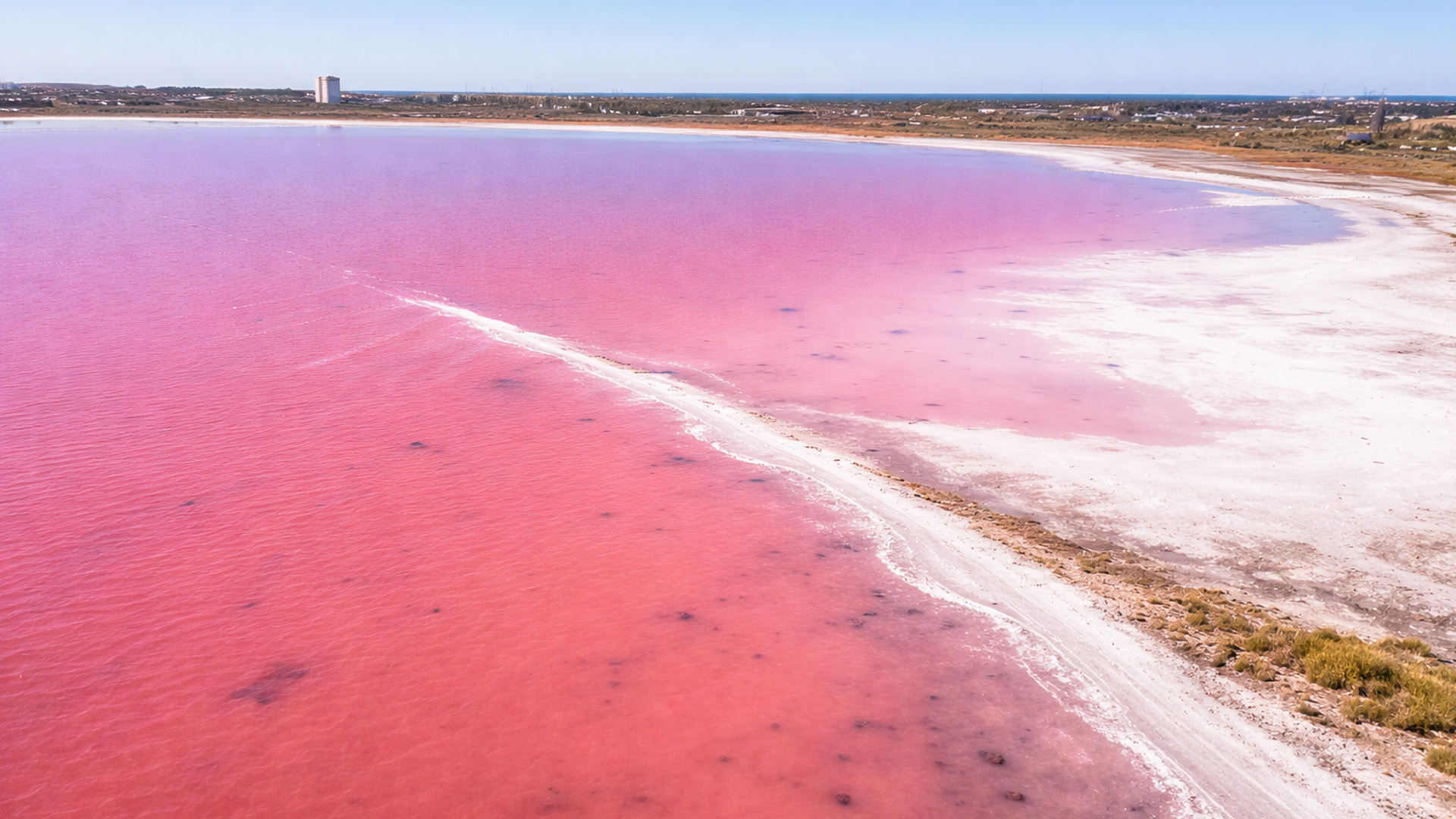 Where salt and algae paint the water pink