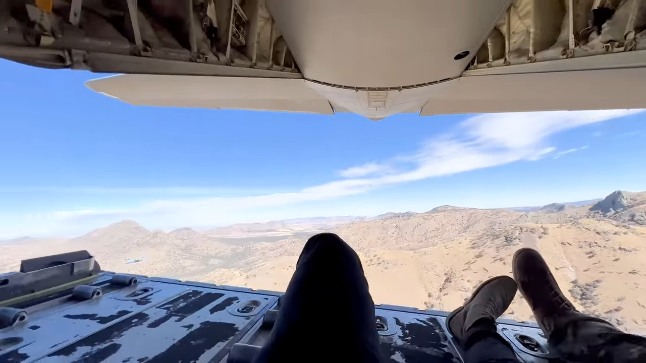 Watch this massive aircraft dive low over mountains with raw power