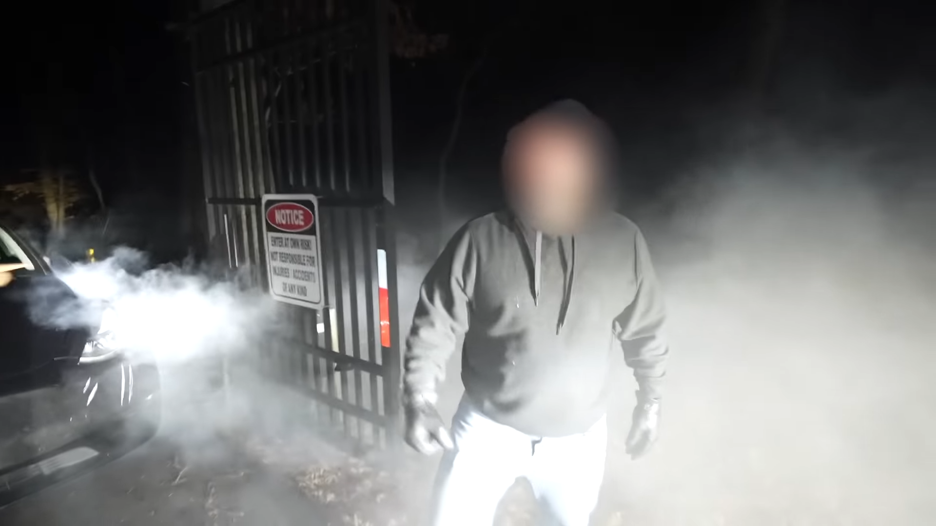 The driveway confrontation took a shocking turn when the car hit the gate