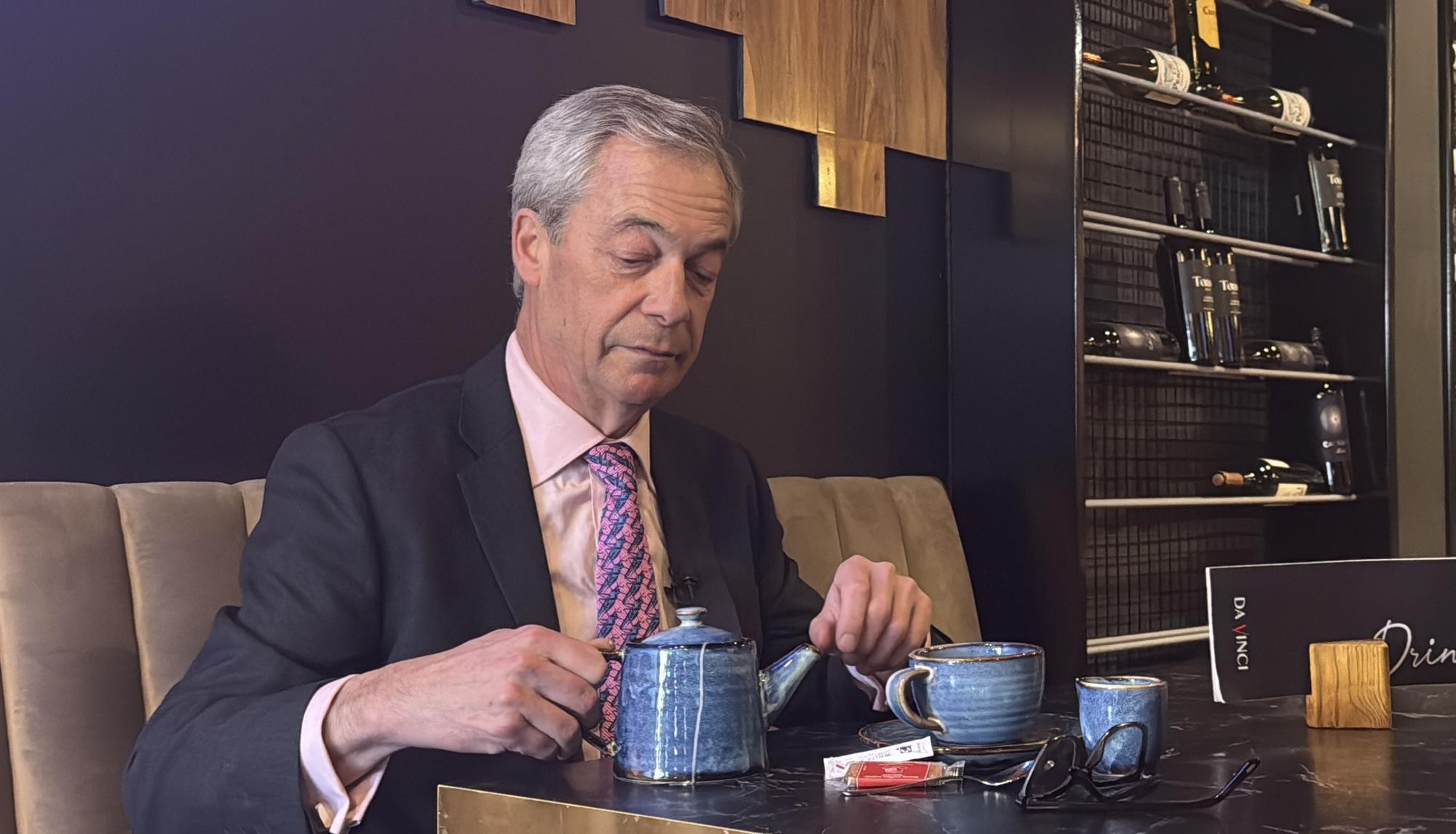 In pictures: Nigel Farage sworn at and labelled 'racist' by angry ...