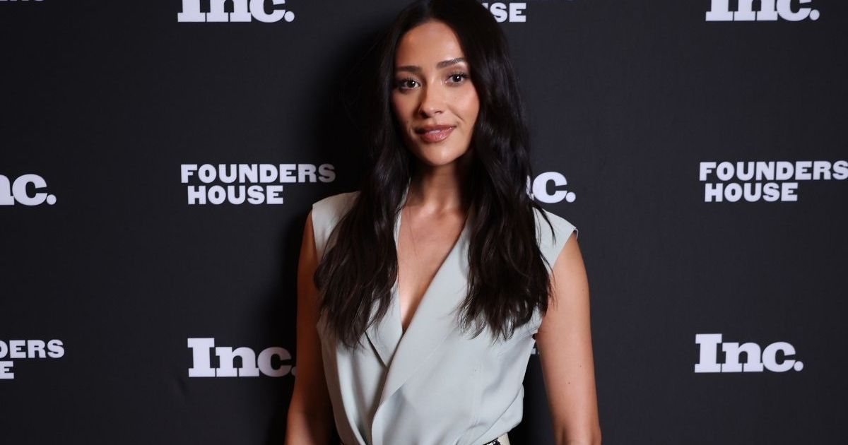 Shay Mitchell brings the 'Baywatch' energy to shoot in red swimsuit