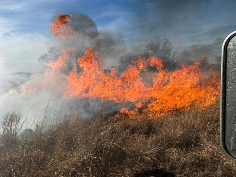 Photos: Multiple departments battle grass fire in Kansas