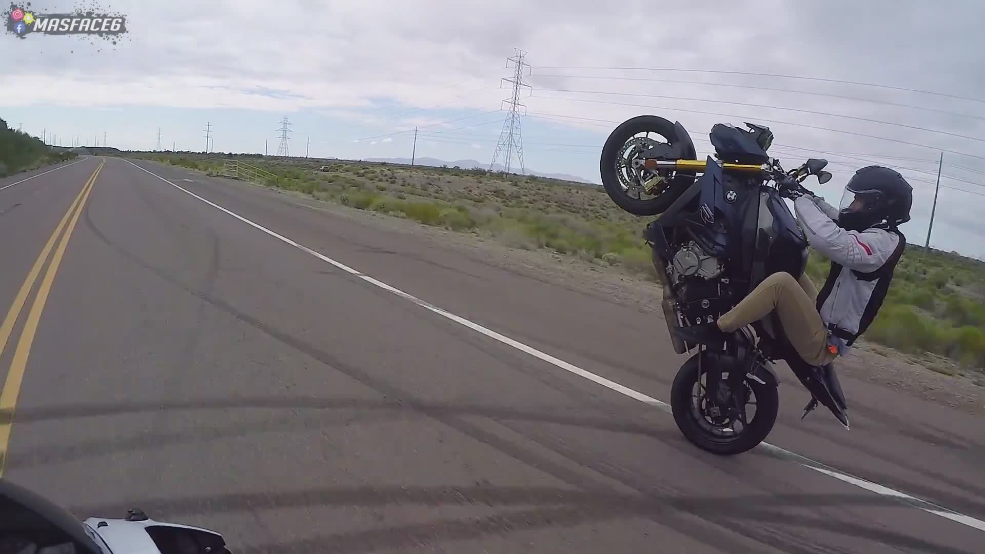 Incredible display of wheelie control on a large adventure motorcycle ...