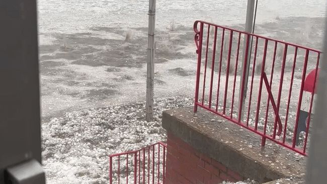 'Extreme hail' pummels flooded street as severe storms hit Illinois
