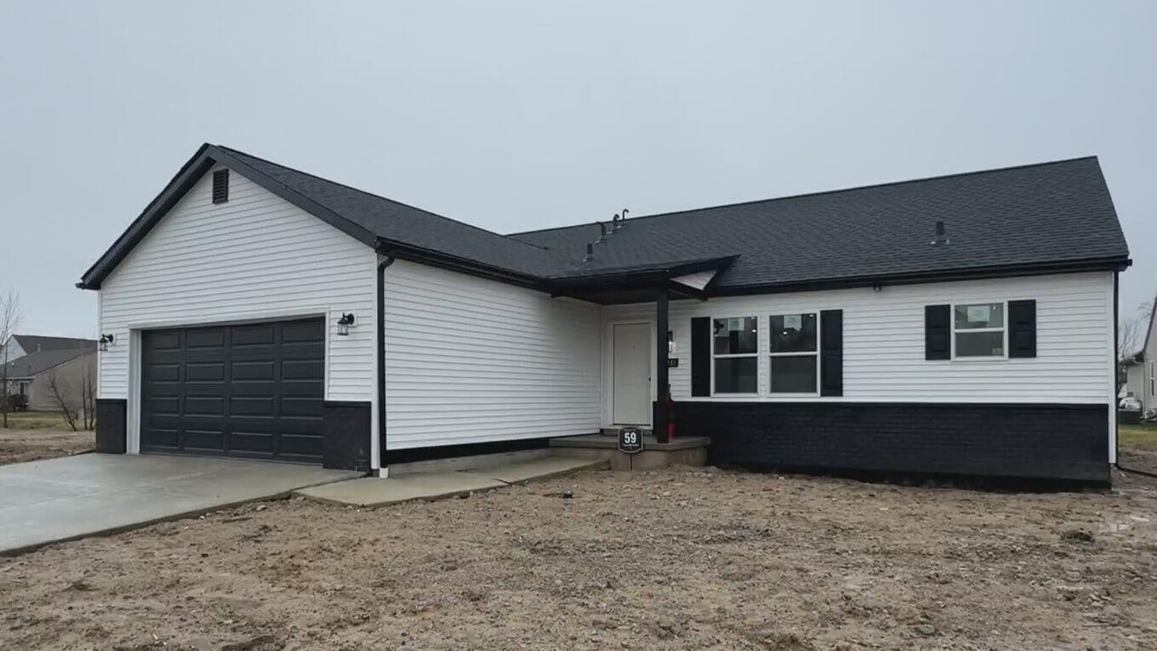 Michigan woman rebuilding her hometown one house at a time