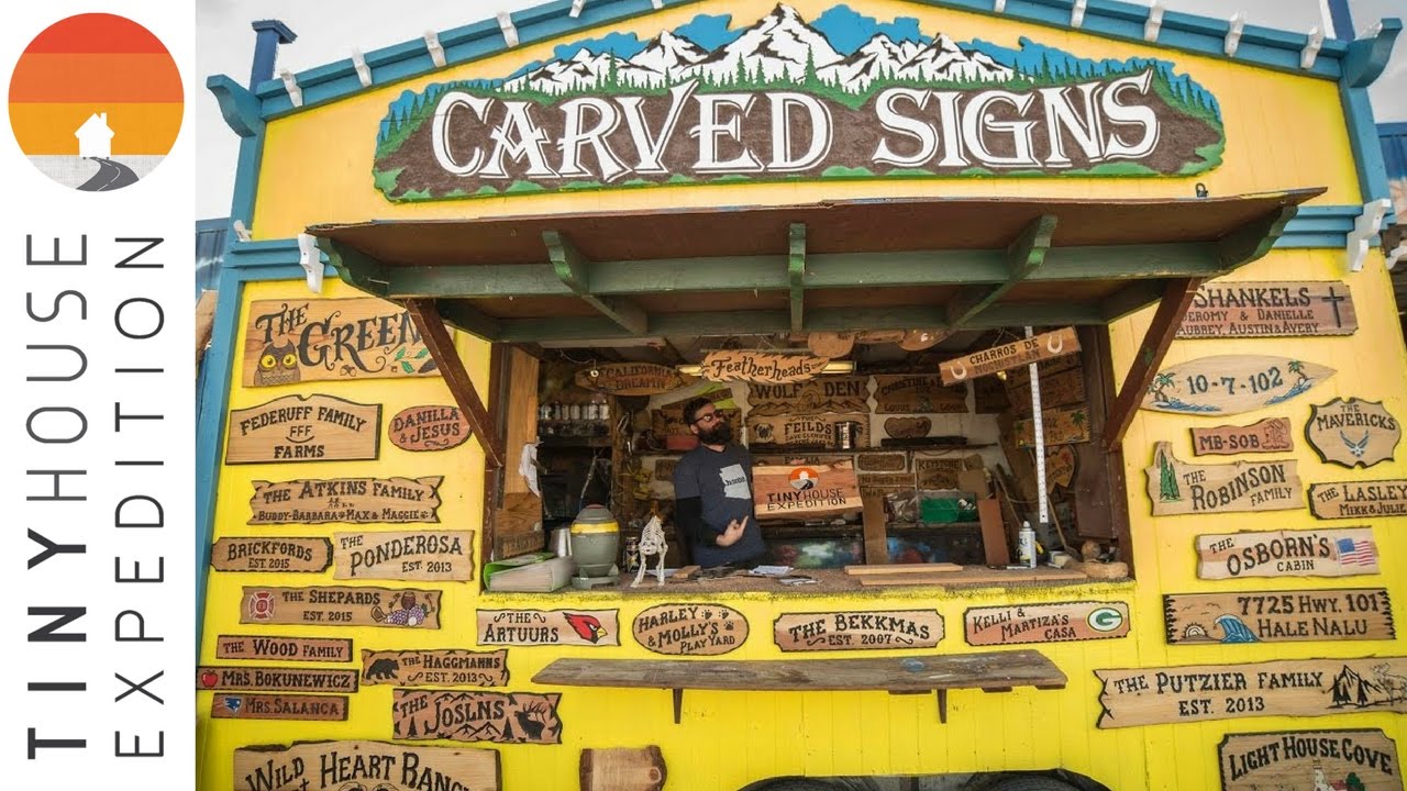 Quirky tiny house sign shop on wheels