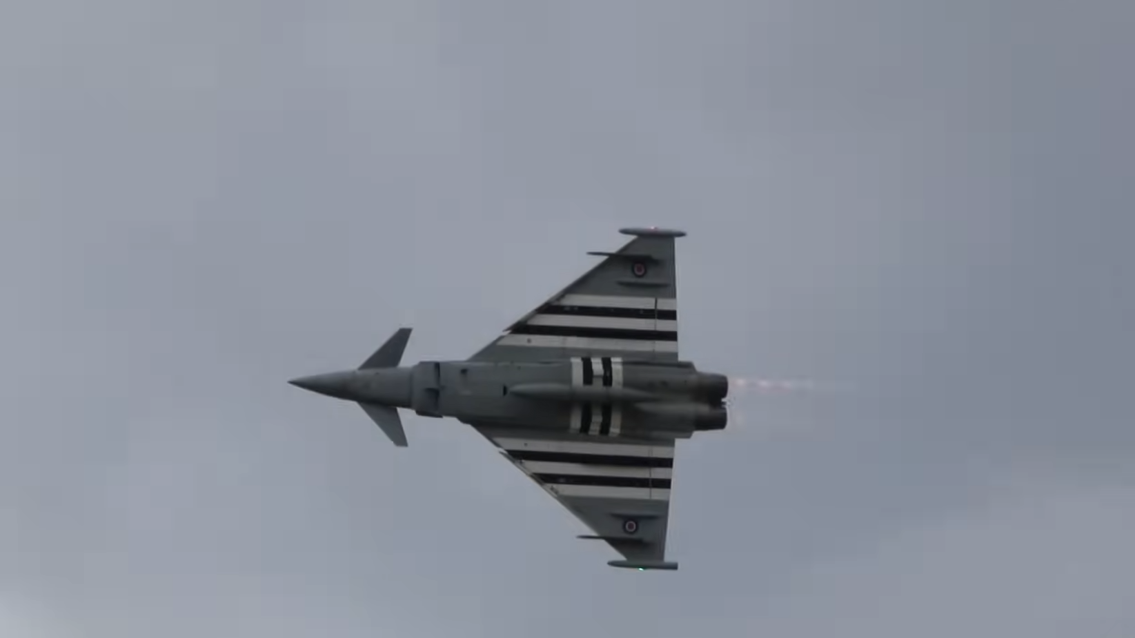 RAF Typhoon roars low over Duxford - crowd feels the shockwave