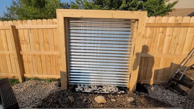 Man builds DIY waterfall feature in his backyard