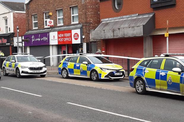 Money 'flying all over the street' after robbery at Wirral post office