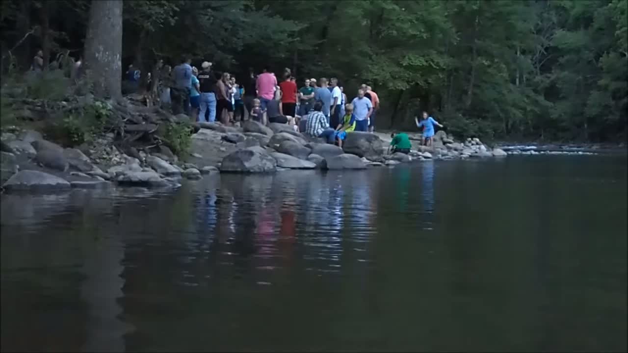 He was treasure hunting in the river - then a baptism ceremony started ...