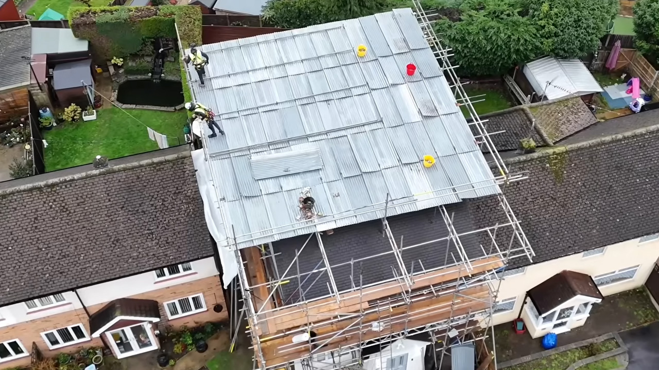 How do contractors protect construction from weather?