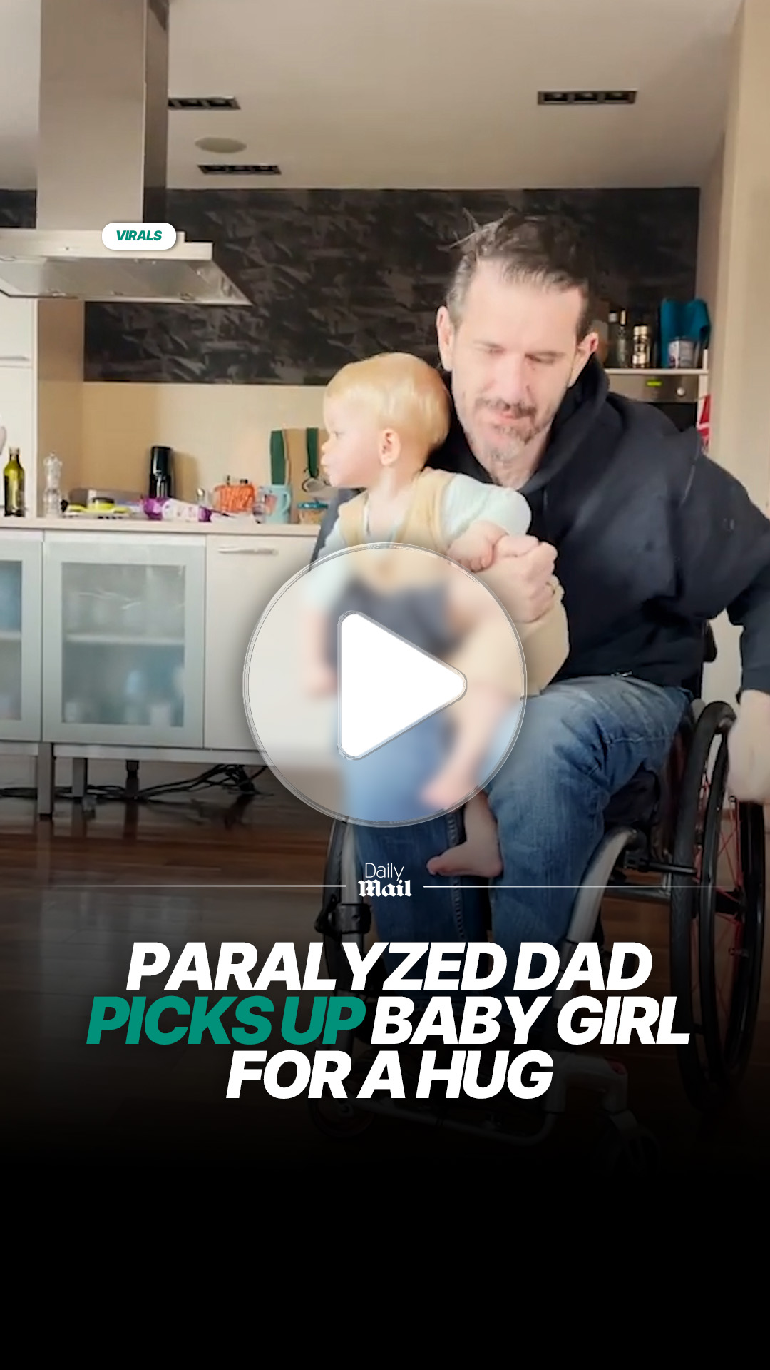 Quadriplegic father shares emotional hug with baby daughter