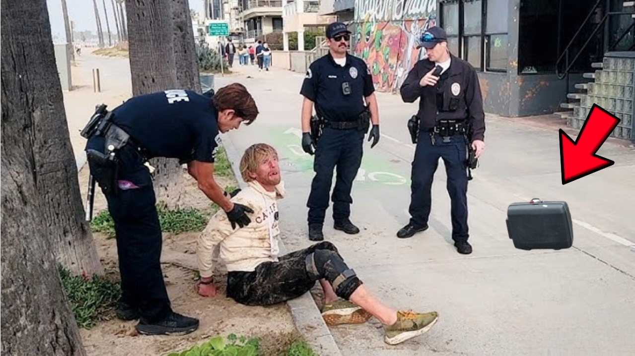 Homeless man keeps pointing at suitcase, officer turns pale when he ...