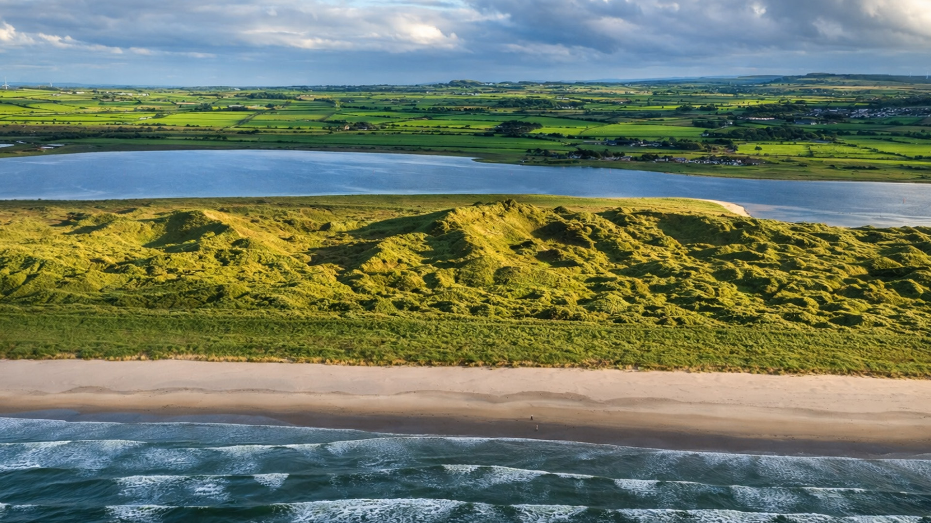 Why does a river run behind this beach?