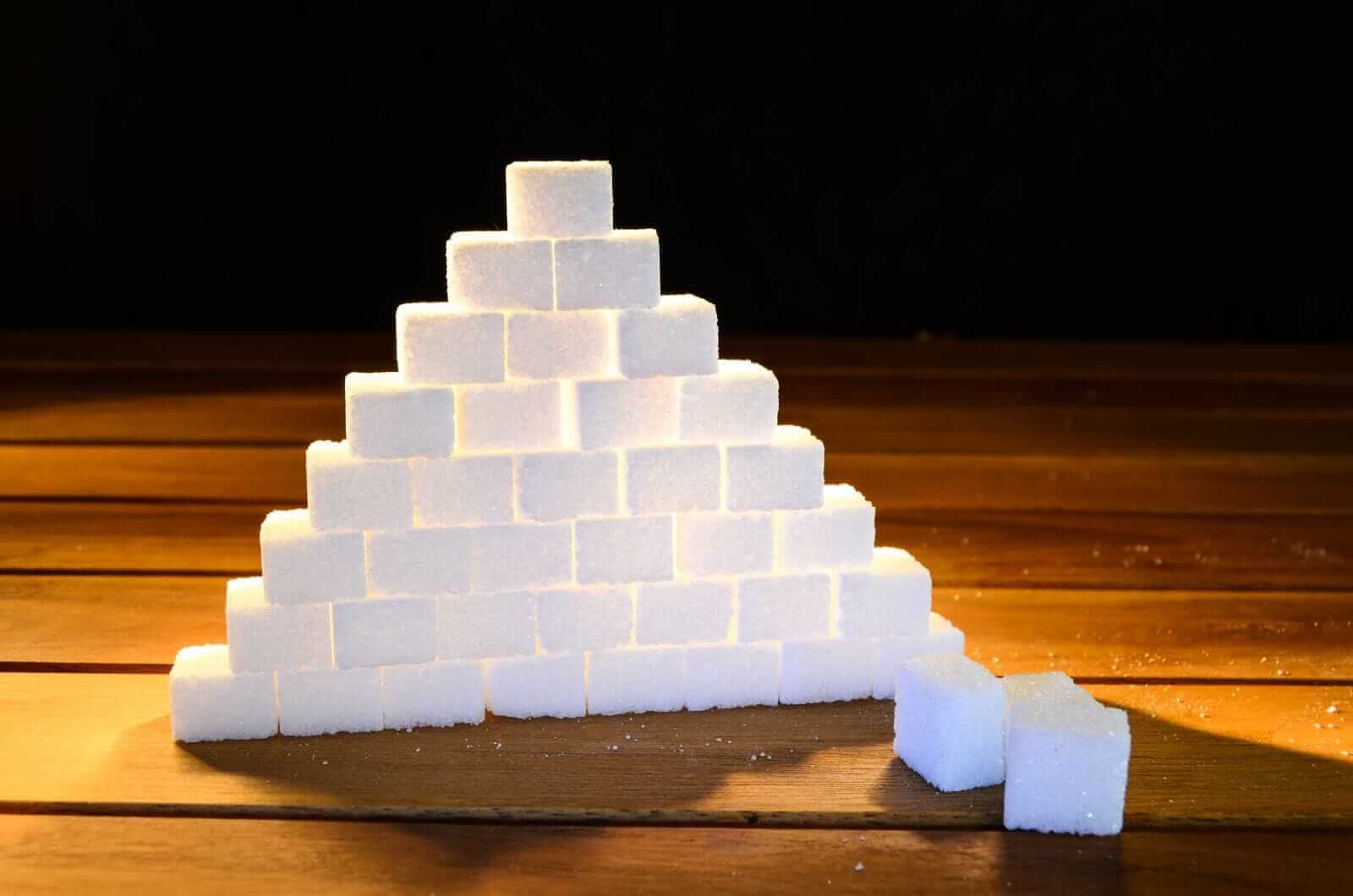 Sugar prices settle higher as crude oil soars