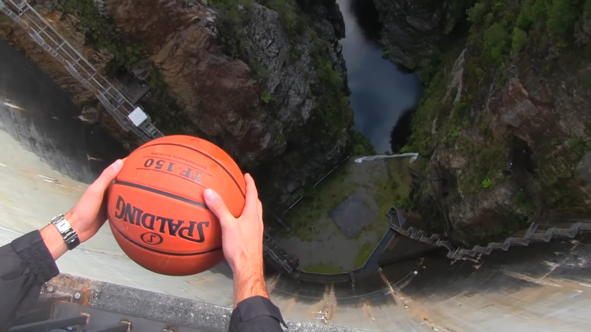 Watch what happens when a basketball is dropped from a 415-foot dam