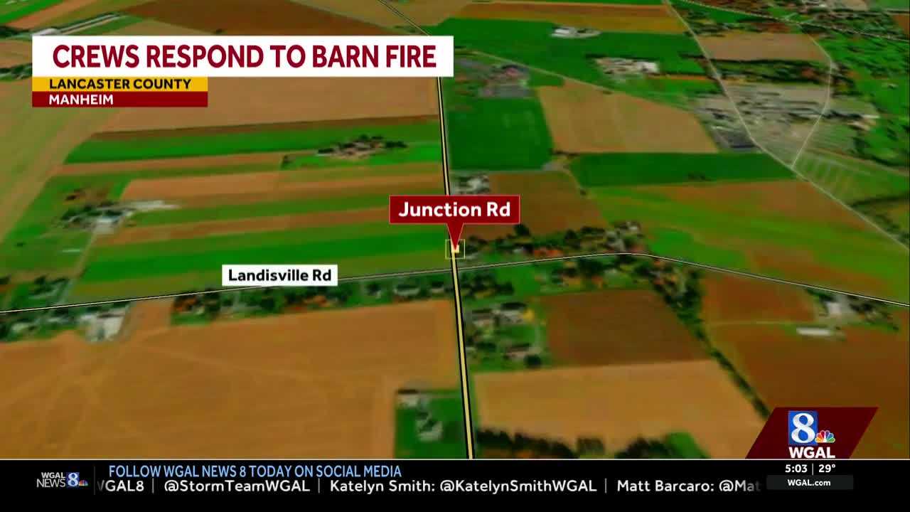 Dozens of crews battle barn fire; extended closure in place