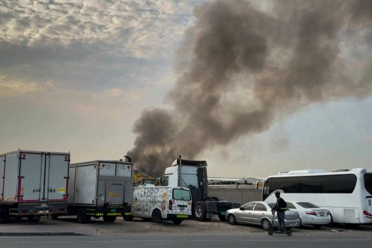 Drone hits Dubai financial district as smoke pours from building