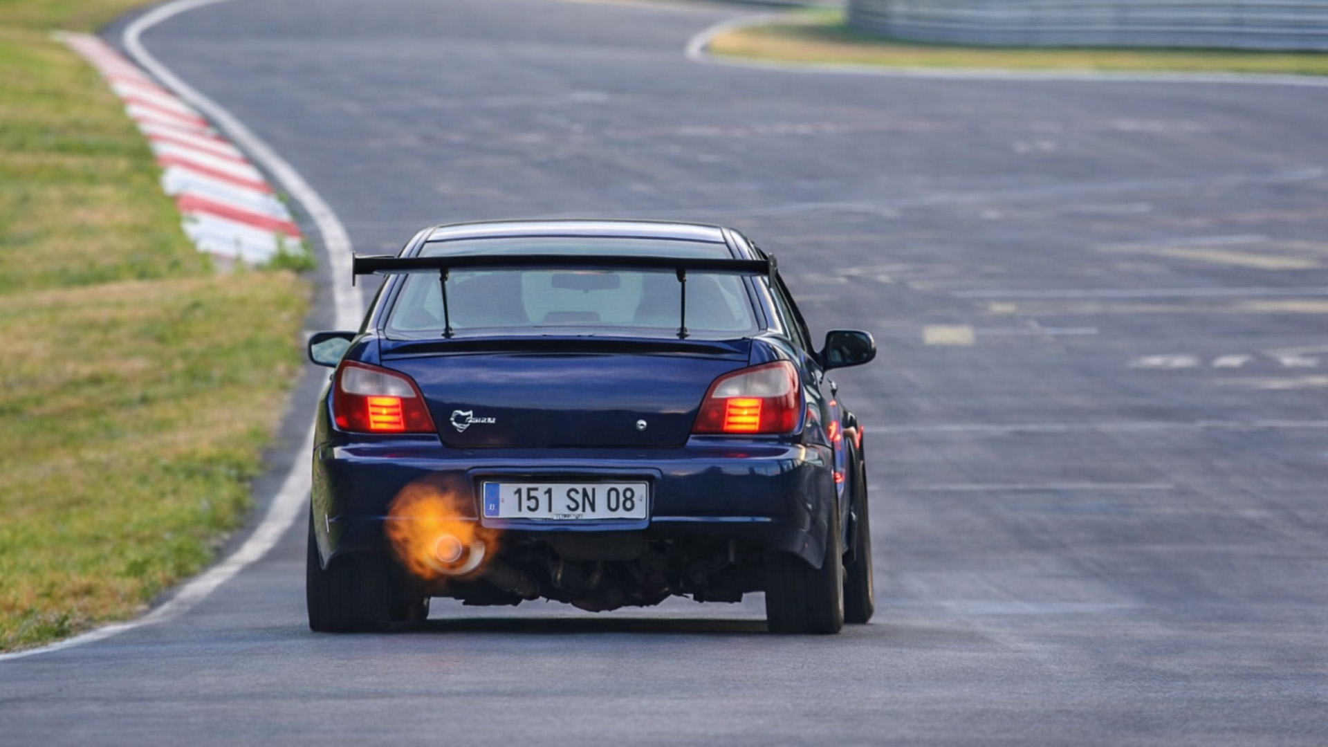 Subaru Impreza launching flames during a fast Nürburgring track run