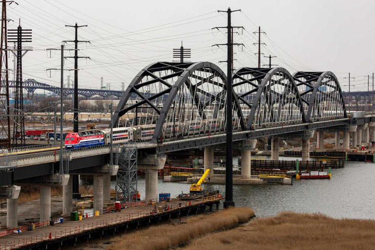 Era of delay-plagued Portal Bridge nears end as first train crosses new ...