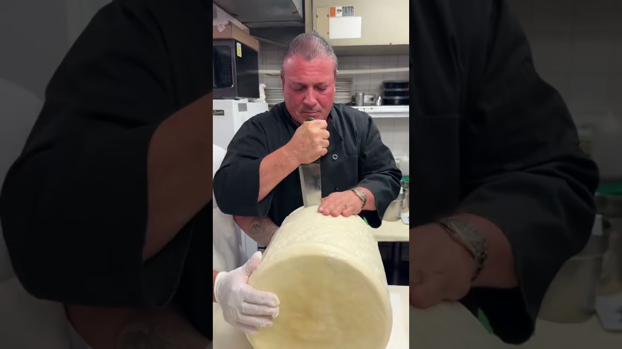 Cutting a 60lb cheese wheel 🧀