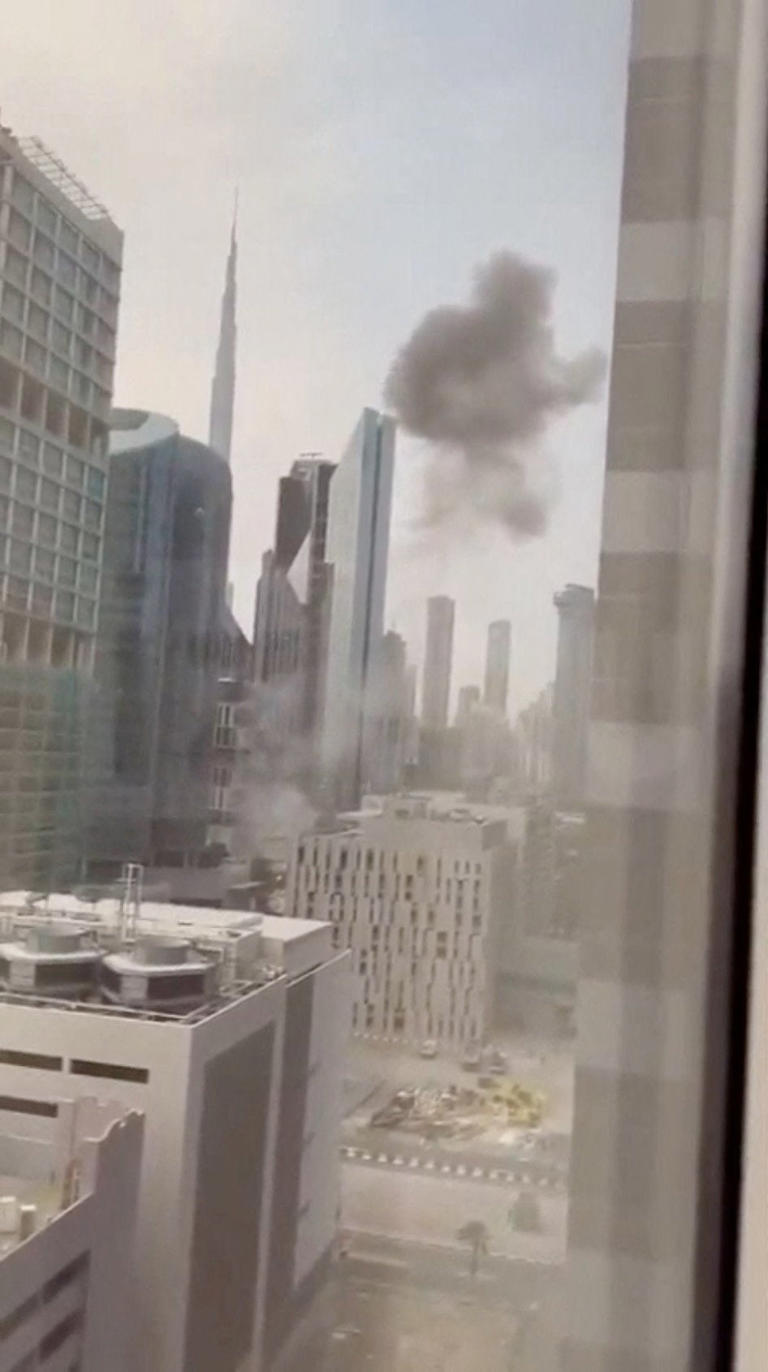 Drone hits Dubai financial district as smoke pours from building