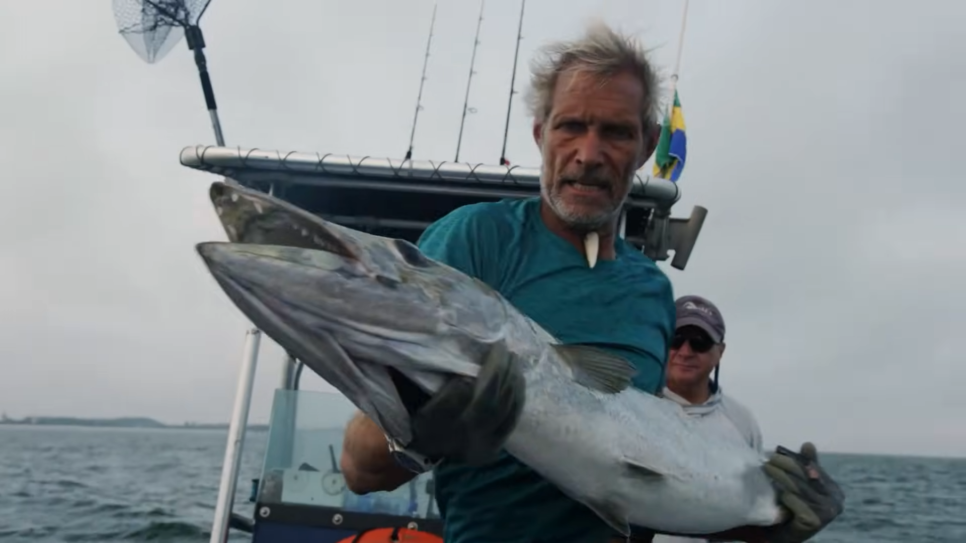 Monster barracuda with razor teeth explodes from the water - fisherman ...