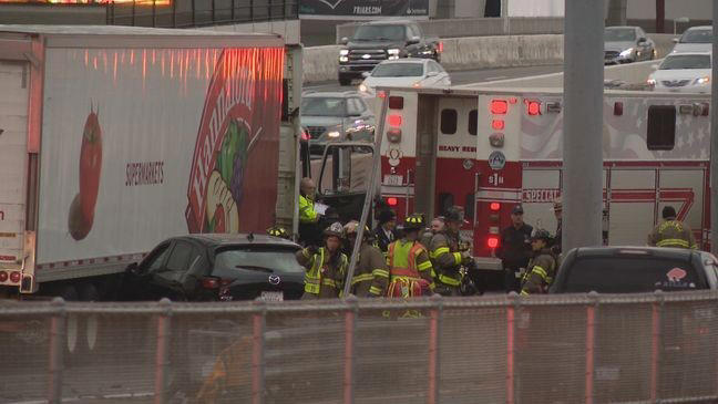Car pinned under tractor trailer after crash in Providence