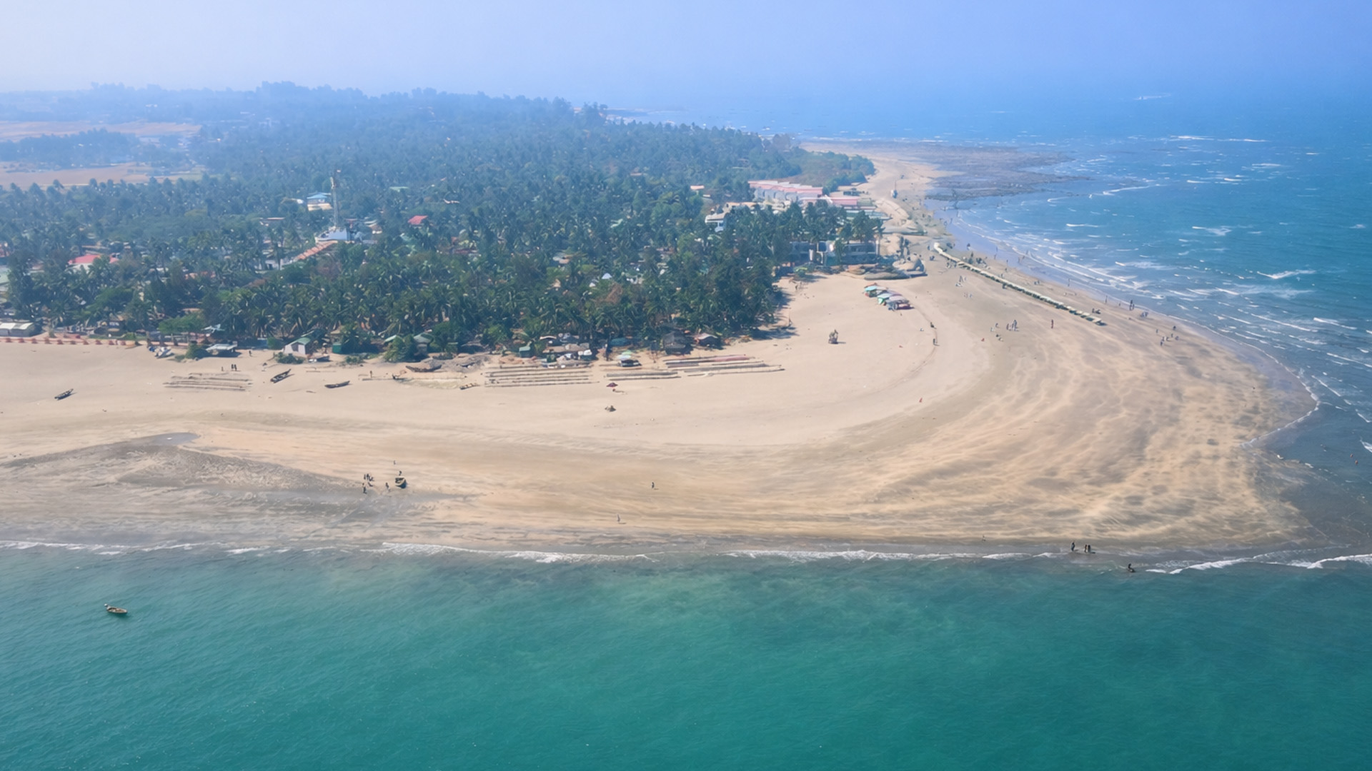 A tropical sandbar stretching into the ocean