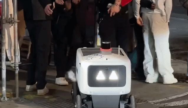 Passersby kick and sit on delivery robot in Philadelphia
