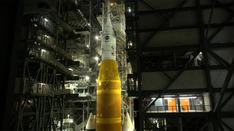Repaired moon rocket heads back to launch pad for April 1 blastoff