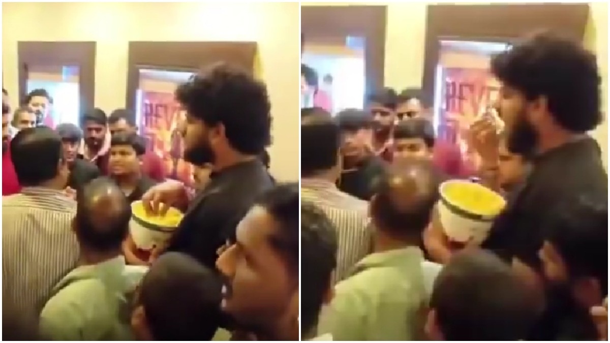 Man casually eats popcorn while watching fans fight outside Dhurandhar ...