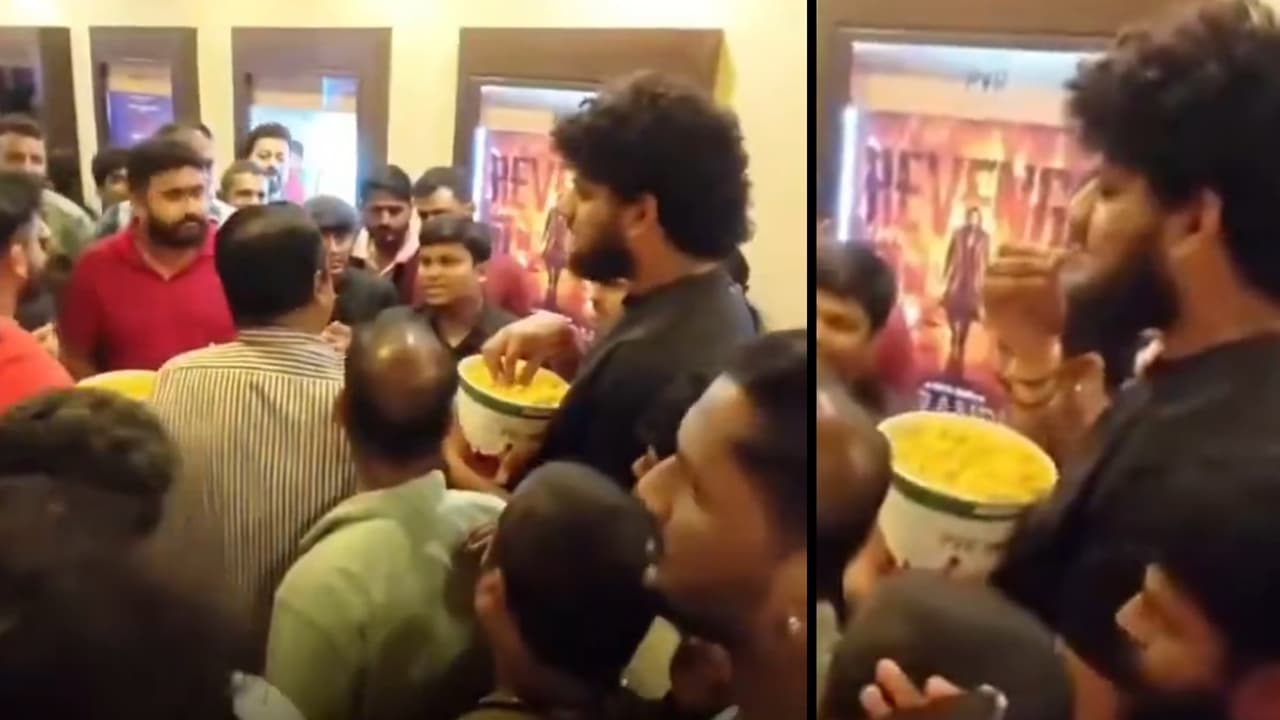 Viral video: Man eats popcorn as fans clash outside 'Dhurandhar 2 ...