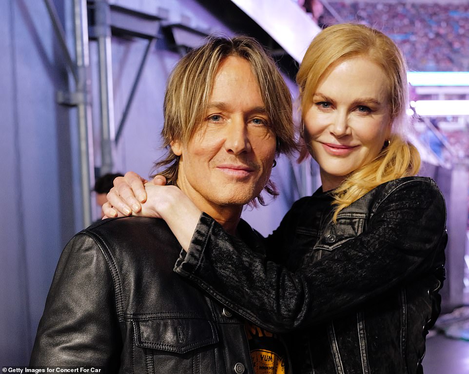 Keith Urban plasters on a smile as he's seen for first time