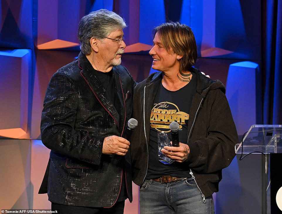 Keith Urban plasters on a smile as he's seen for first time