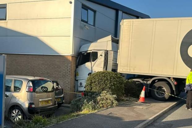 Lorry crashes into commercial building