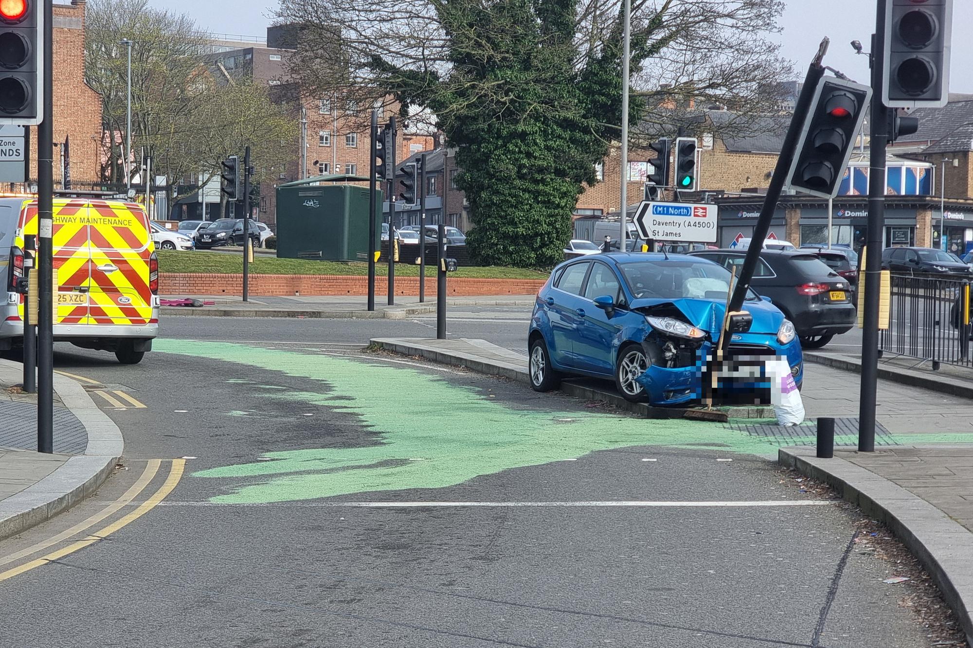 Blue Ford Fiesta crashes into lamp-post off busy Northampton roundabout ...