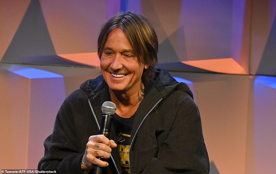 Keith Urban plasters on a smile as he's seen for first time