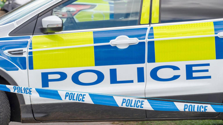 Two police officers on emergency call injured in crash