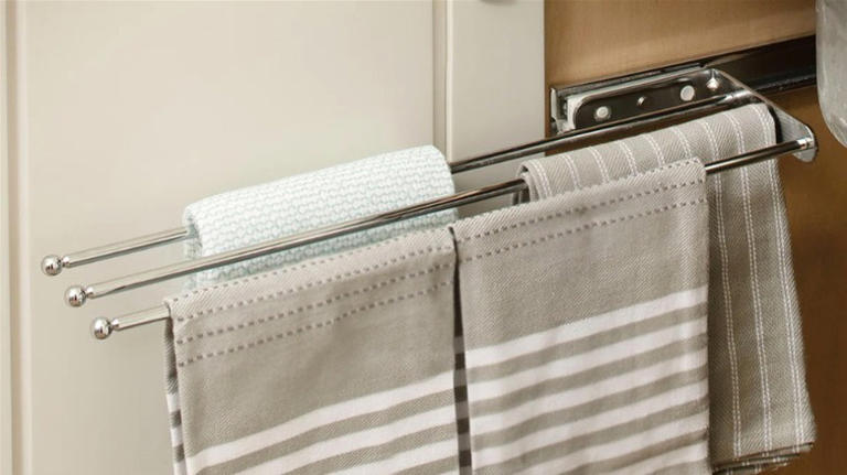Keep kitchen towels off countertops with a smart sliding storage solution