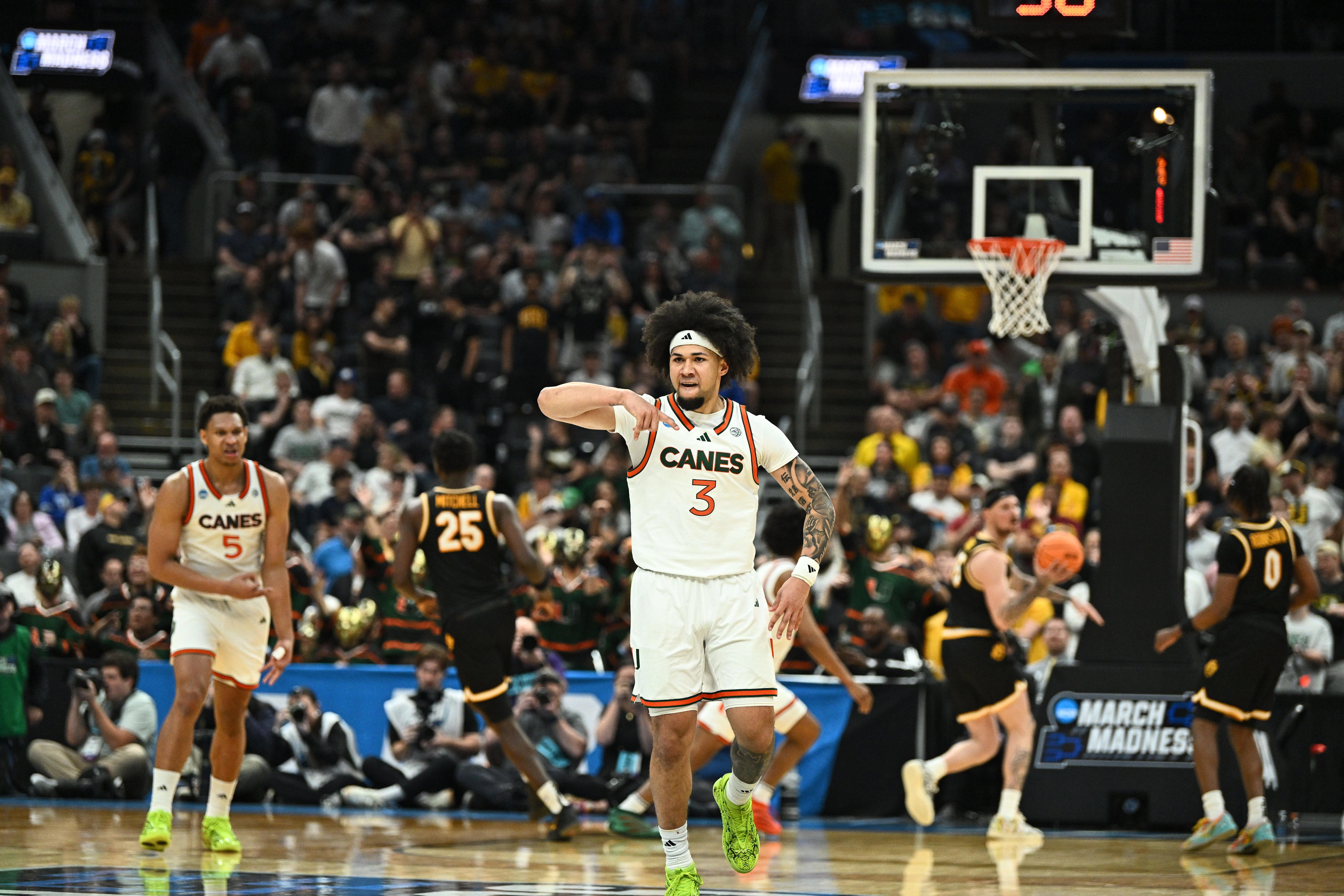 Former Auburn guard Tre Donaldson leads Miami to March Madness win