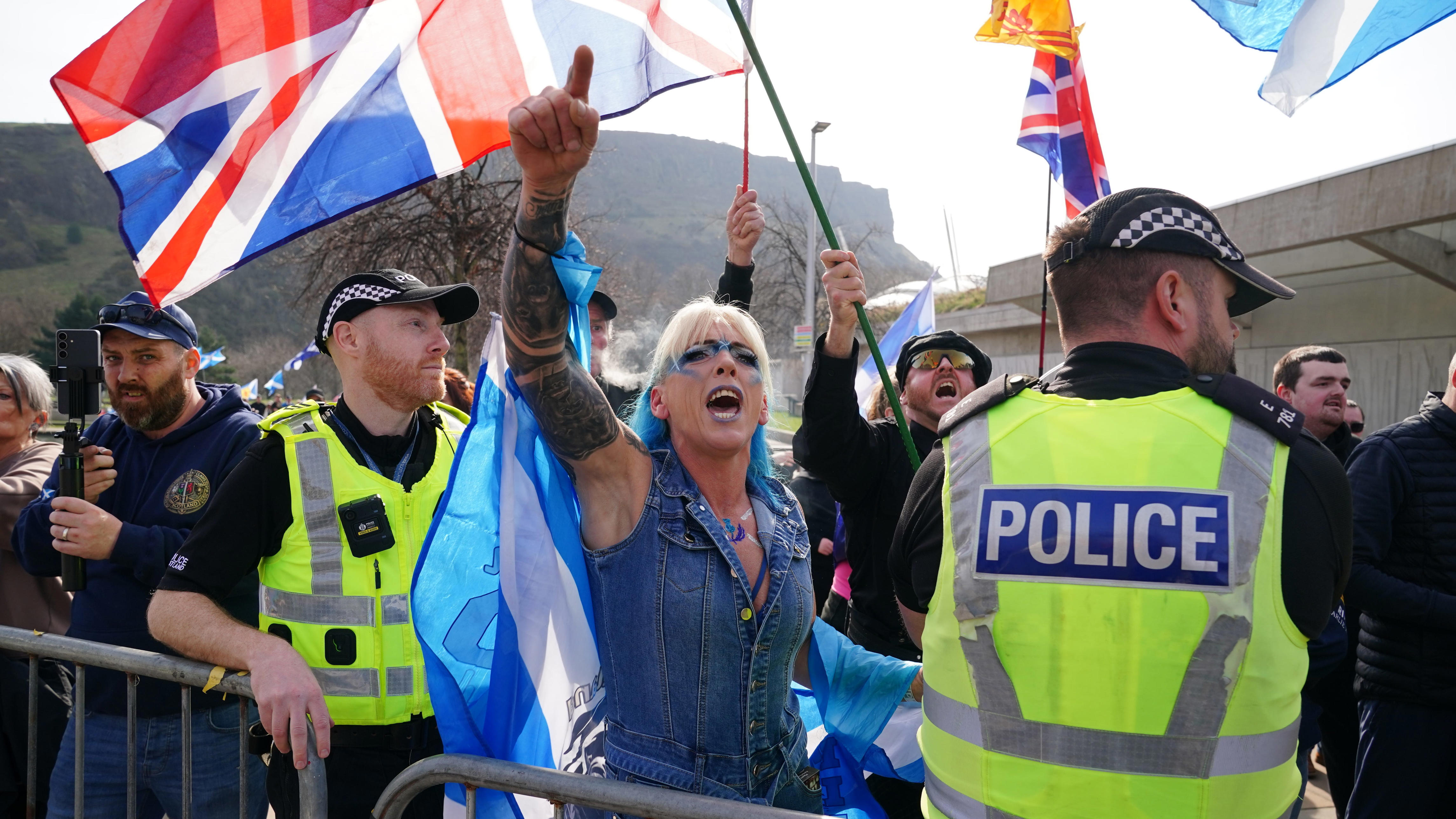 Police keep opposing groups apart as anti-immigration rally held at ...