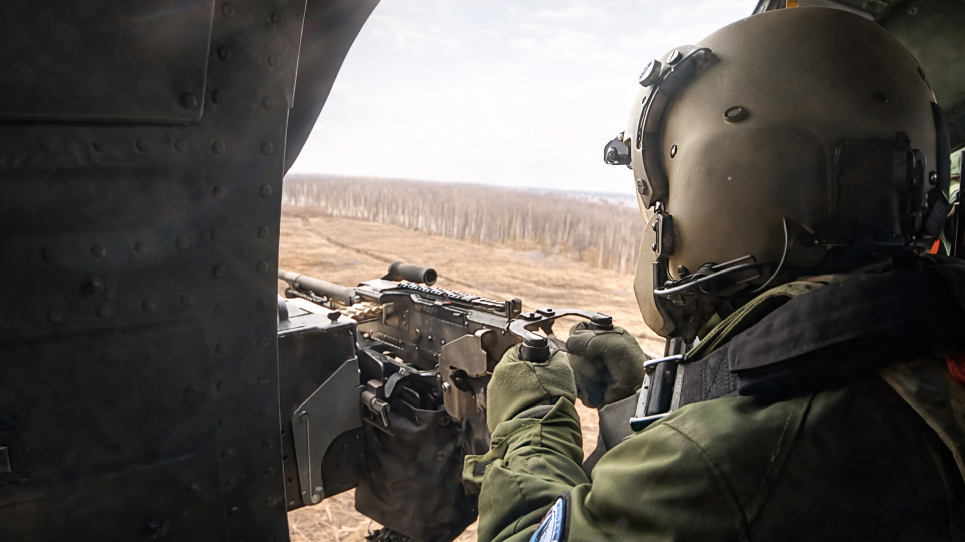 US and Latvian forces train UH-60 helicopter gunnery