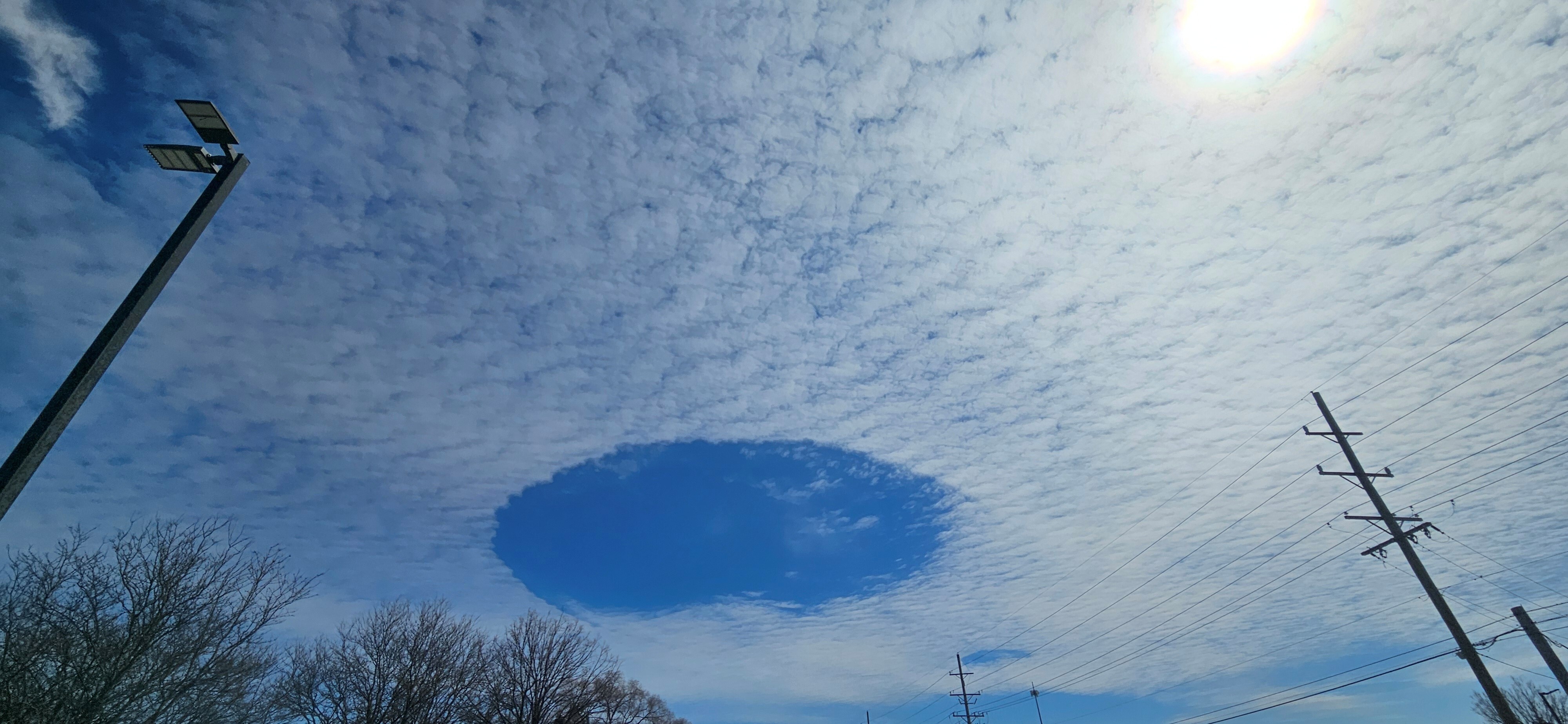 Rare 'hole punch' clouds seen over west suburbs of Chicago