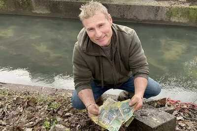 Father and son discover hidden safe in river, return it to owner