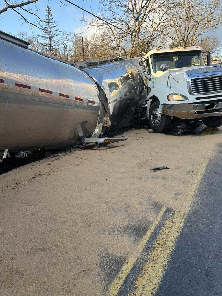 Tanker truck crash shuts down bridge, spills milk into nearby waterway