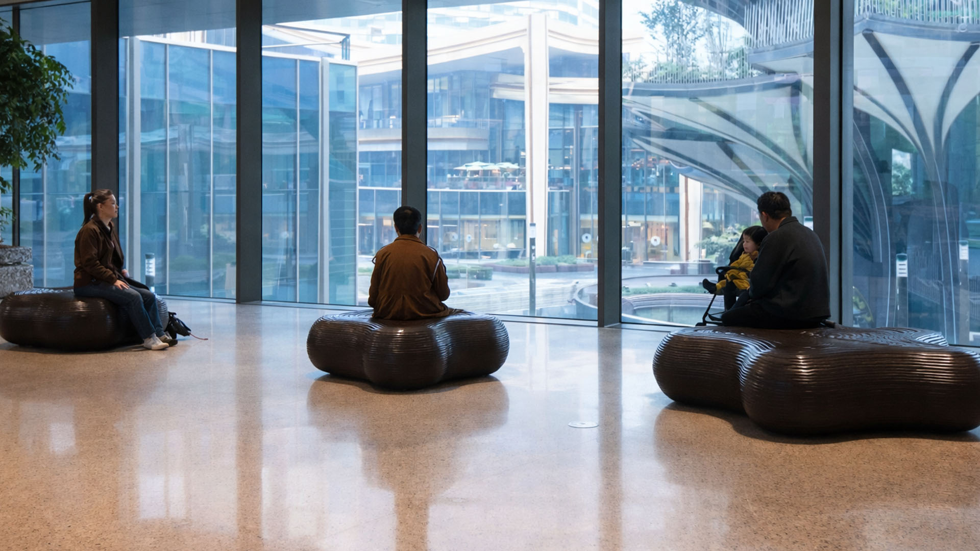 People sit quietly facing a tree-like structure in China